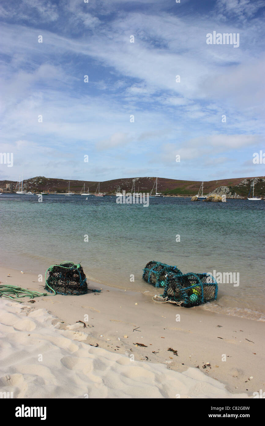 lobster pots left on the beach at bryher isles of scilly Stock Photo ...
