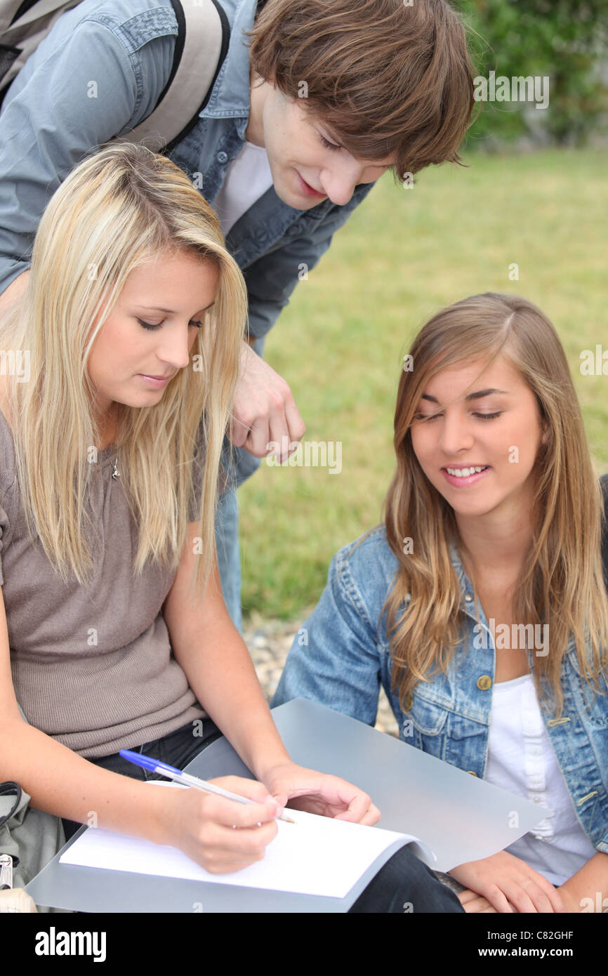 Students sitting in a park Stock Photo - Alamy