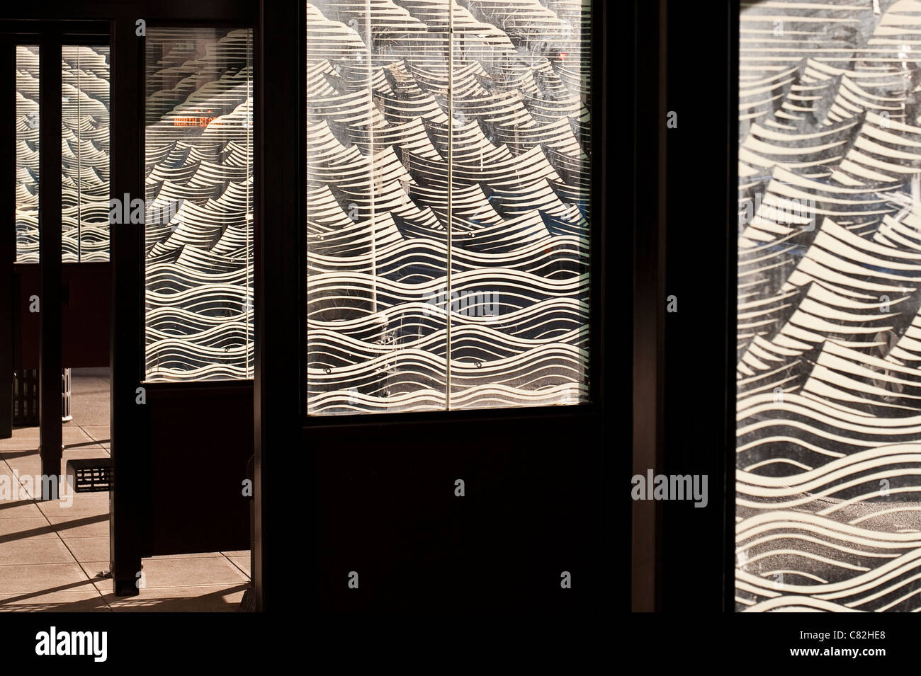 Design patterns waves on a bus stop shelter windows downtown Seattle ...