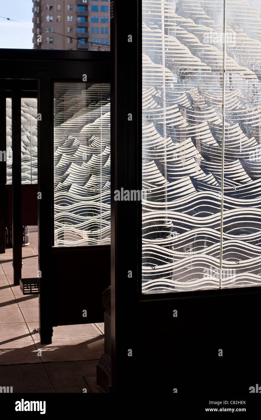 Design patterns waves on a bus stop shelter windows downtown Seattle ...