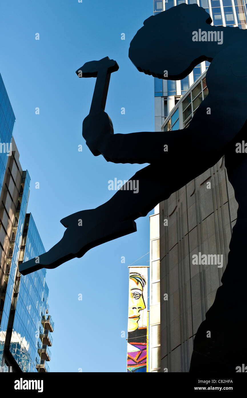 Downtown Seattle street scene with Hammering man in front of the ...