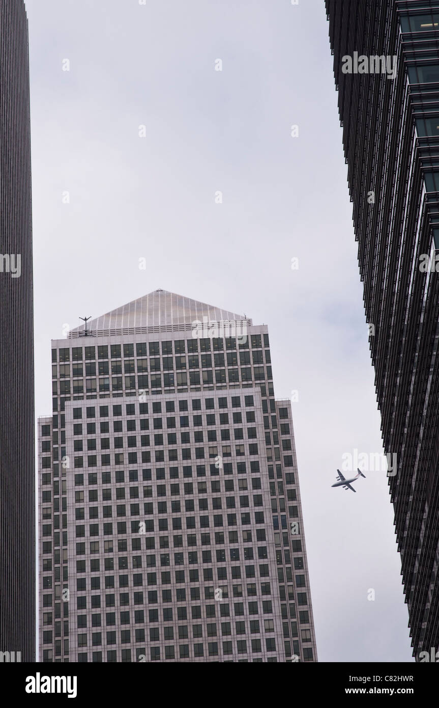 A view of One Canada Square with an airplane on its approach to City ...