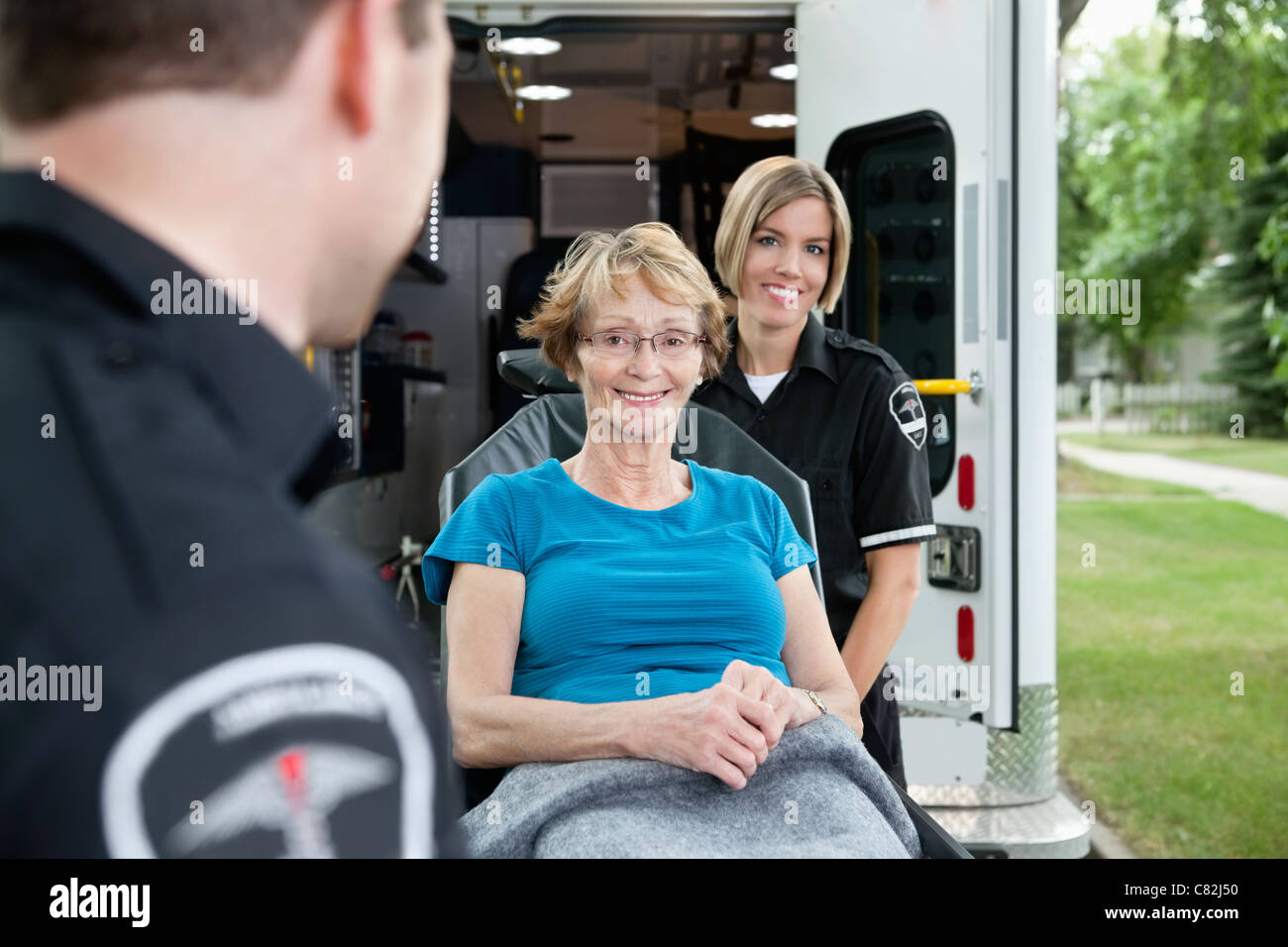 Portrait of a healthy senior citizen on an ambulance stretcher Stock ...
