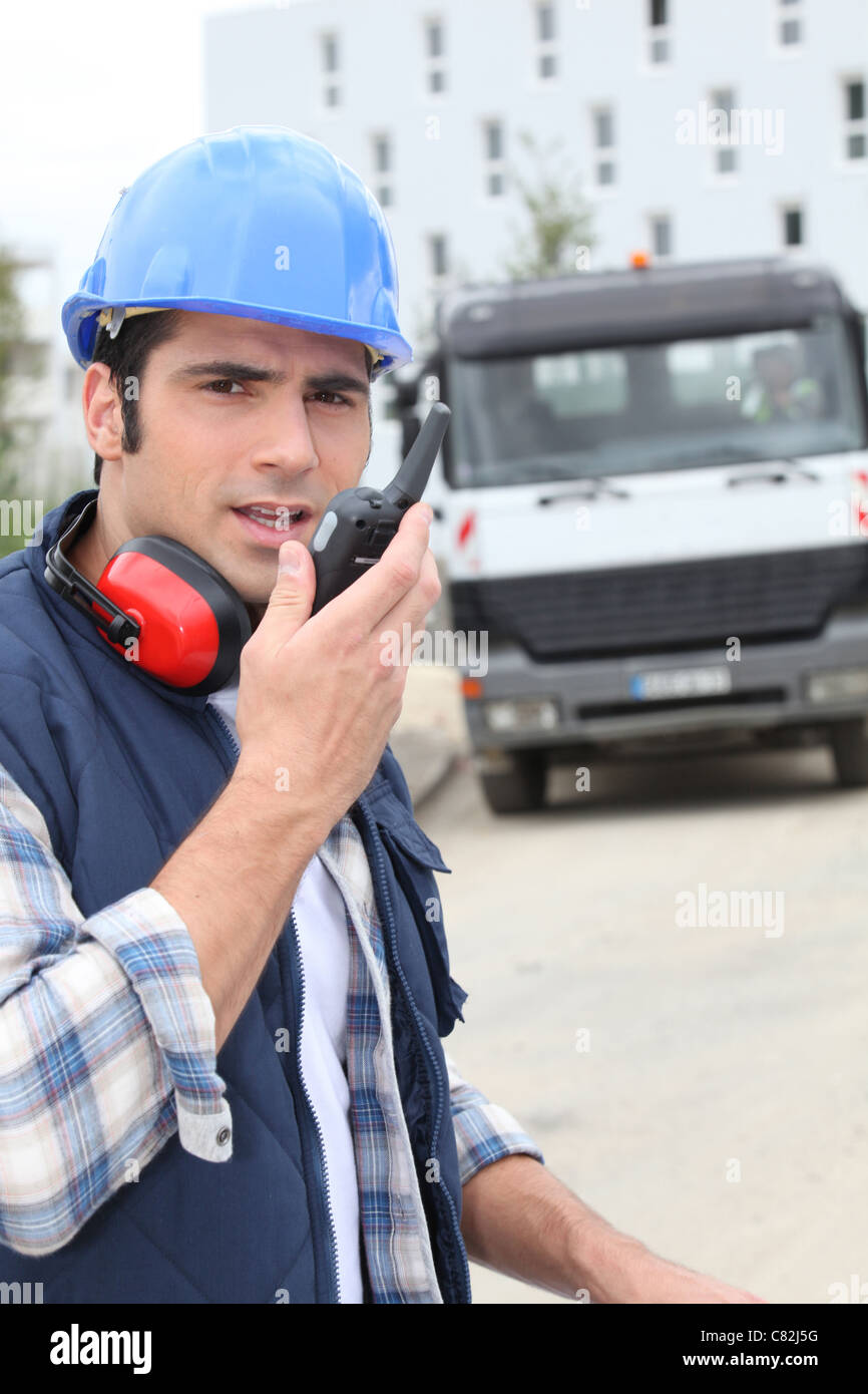 Foreman overlooking work site Stock Photo - Alamy