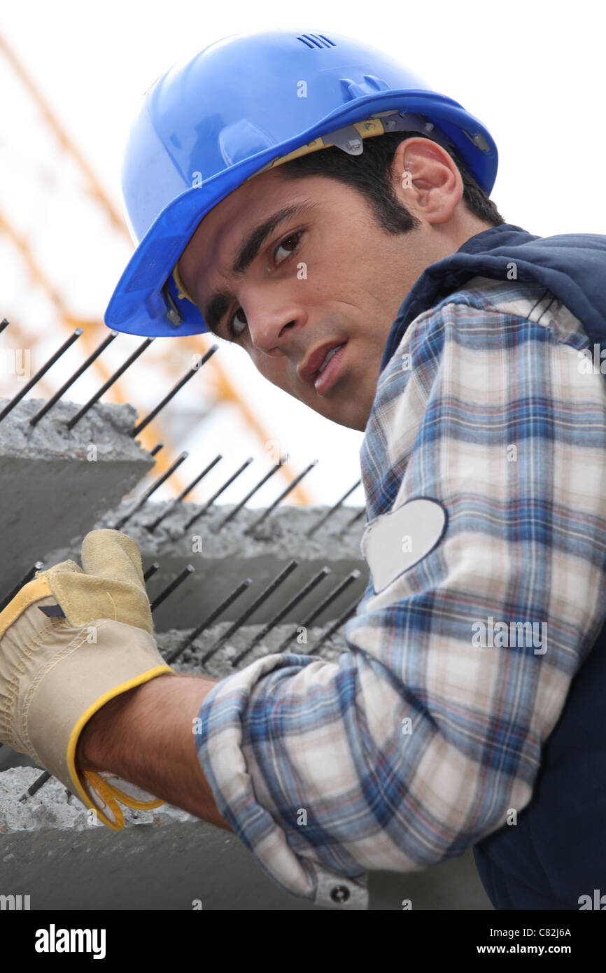 Construction worker with slabs of reinforced concrete Stock Photo - Alamy