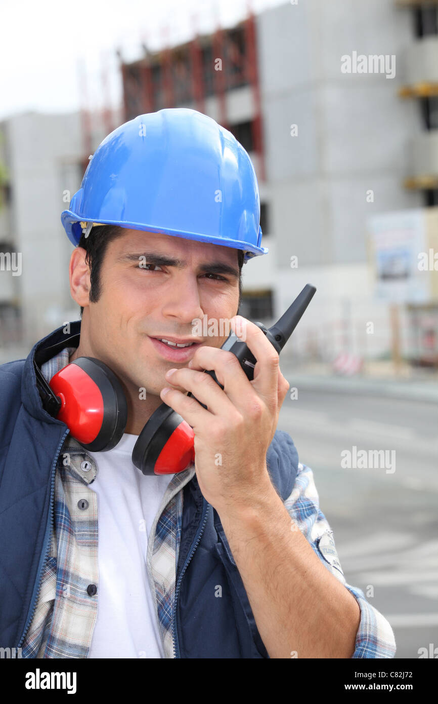 Construction worker with radio Stock Photo - Alamy
