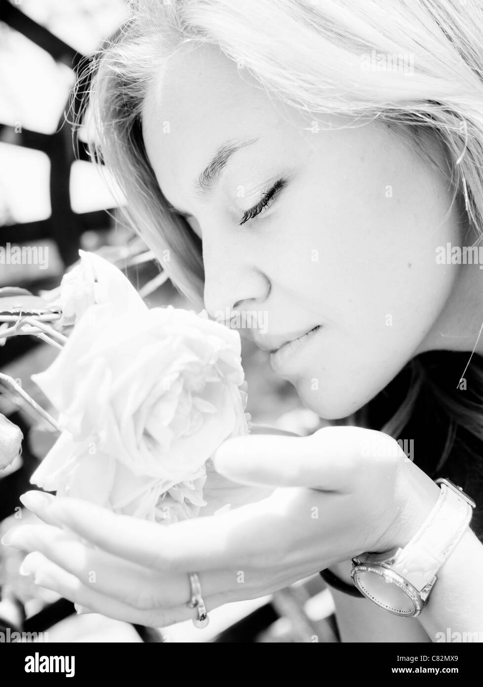 Smelling rose garden Black and White Stock Photos & Images - Alamy