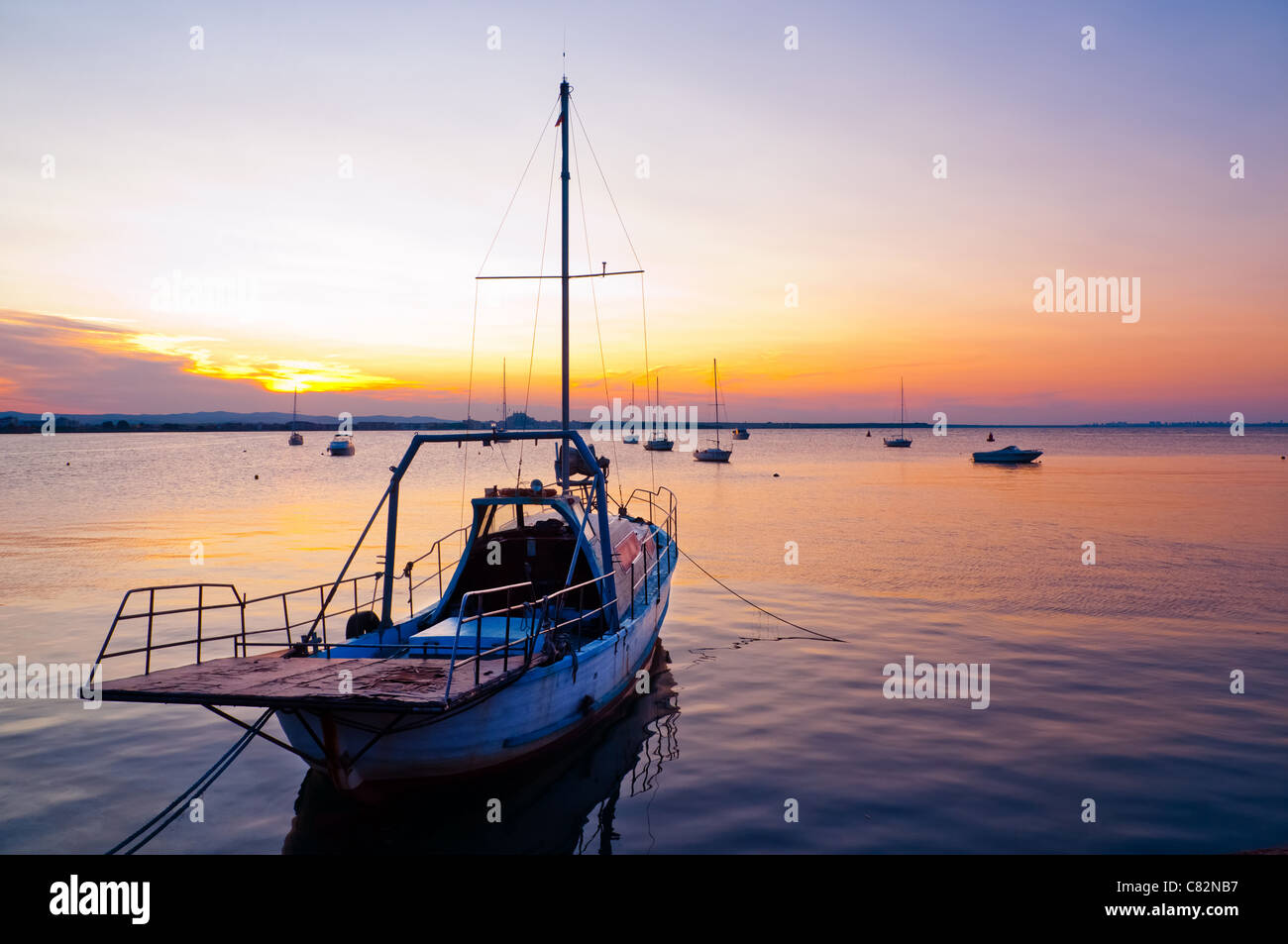 Beautiful sea sunset and ship Stock Photo - Alamy