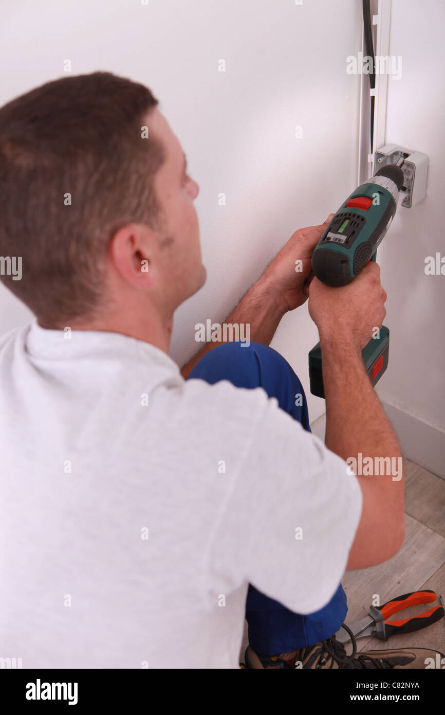 Back view man drilling hi-res stock photography and images - Alamy