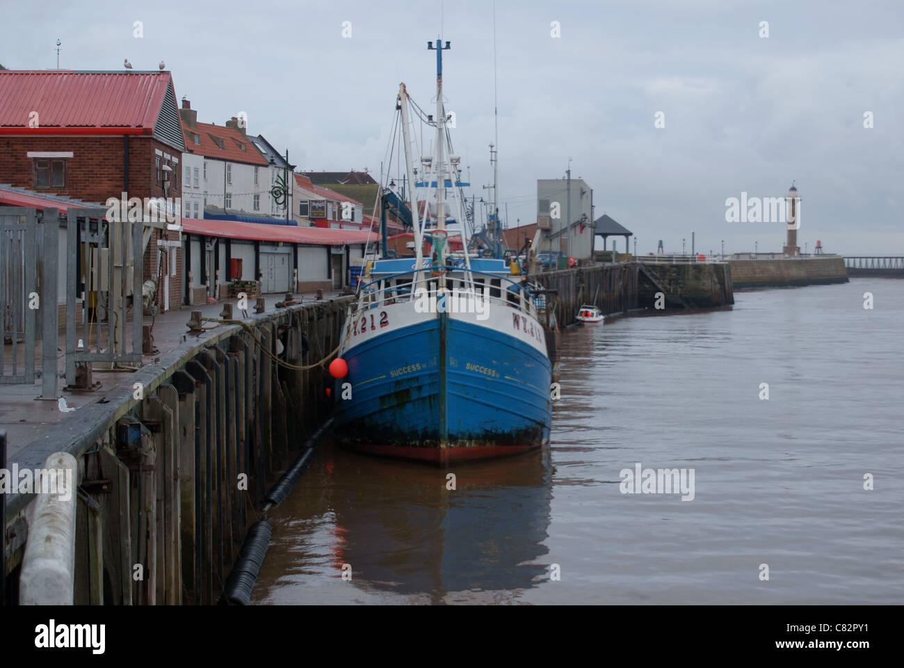 Fishing boat in Whitby Harbor Stock Photo - Alamy