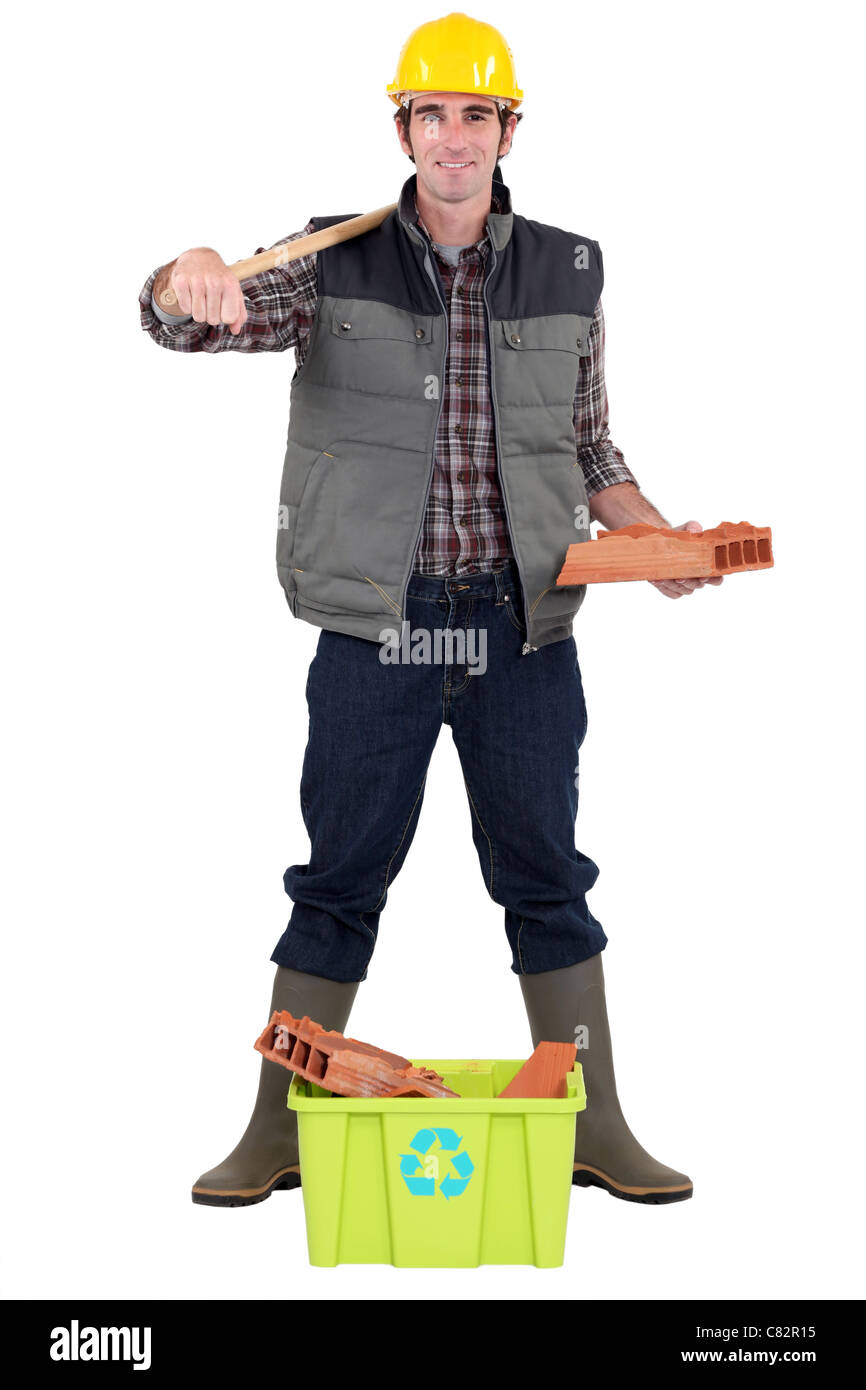 Construction worker stood with recyclable waste material Stock Photo ...