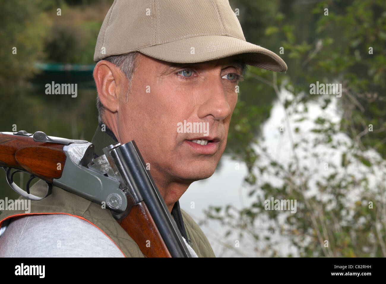 Man with a rifle Stock Photo - Alamy