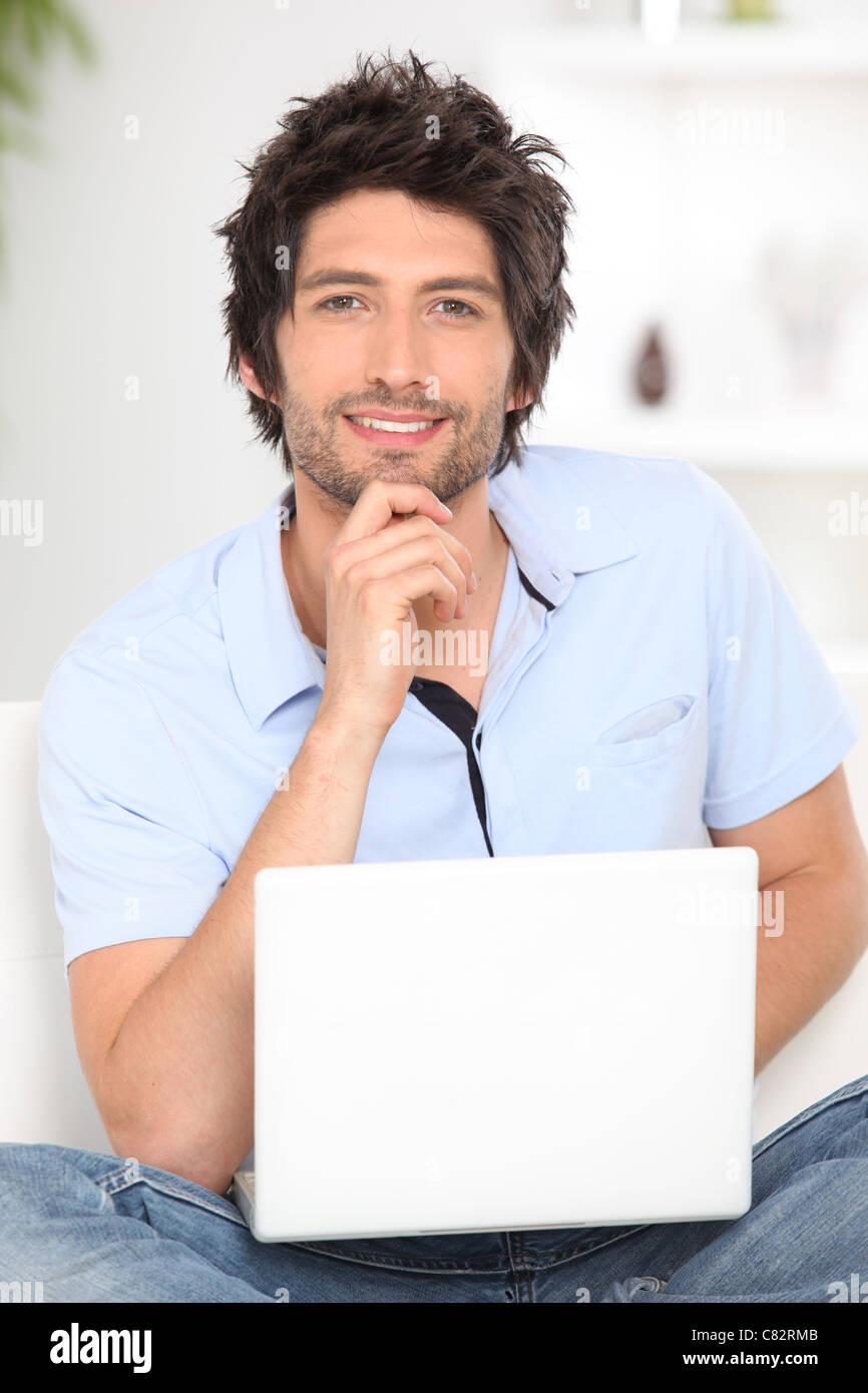 Man looking up from his work Stock Photo - Alamy