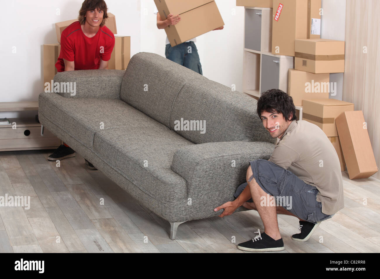 picture of friends moving a couch Stock Photo - Alamy