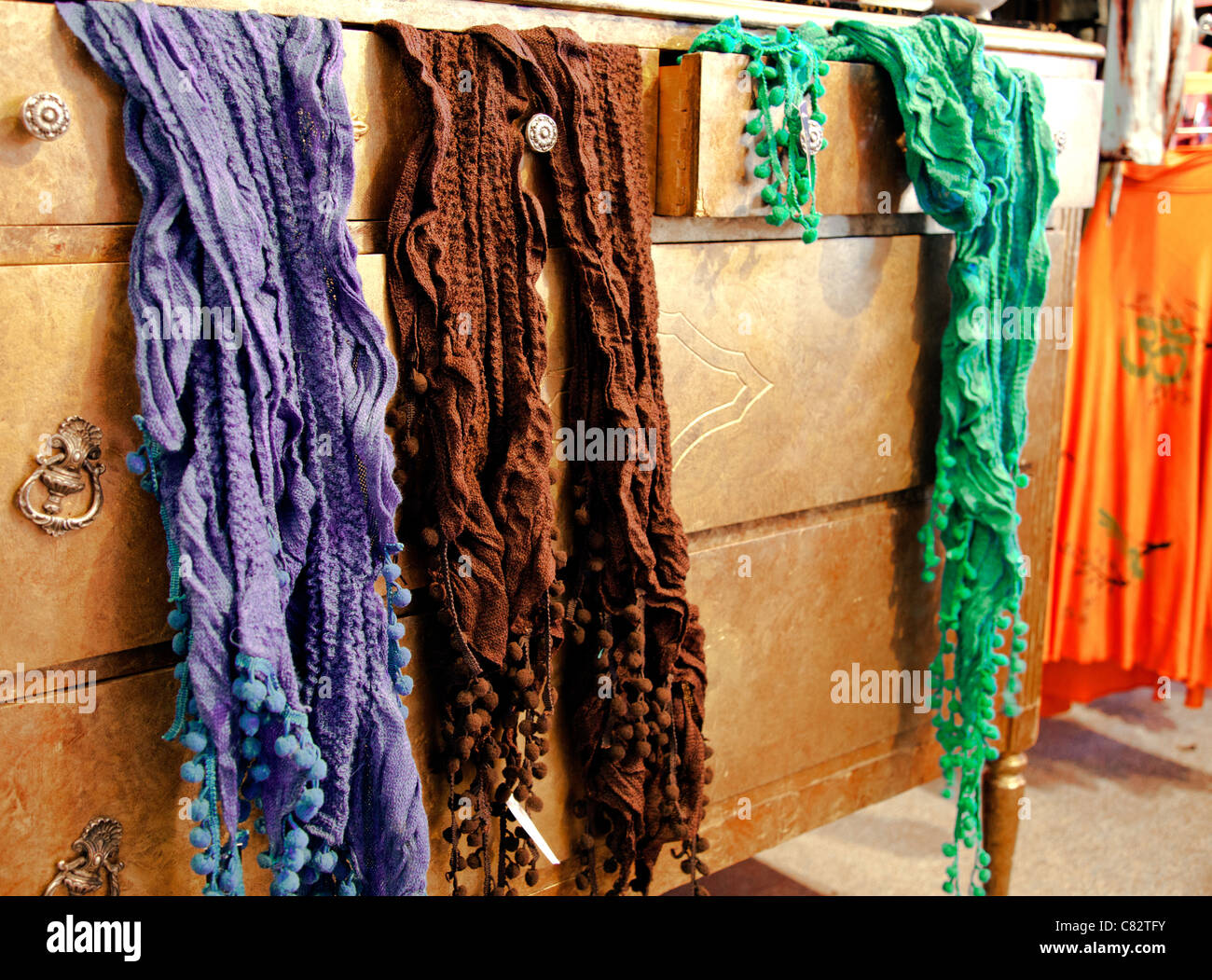 Shawls hanging from a dresser Stock Photo - Alamy