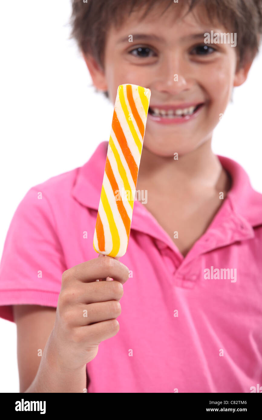 Boy with a lolly pop Stock Photo - Alamy