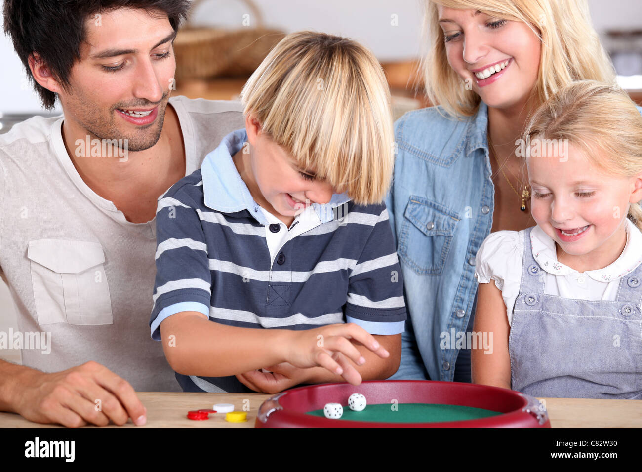 portrait of a family playing games Stock Photo - Alamy
