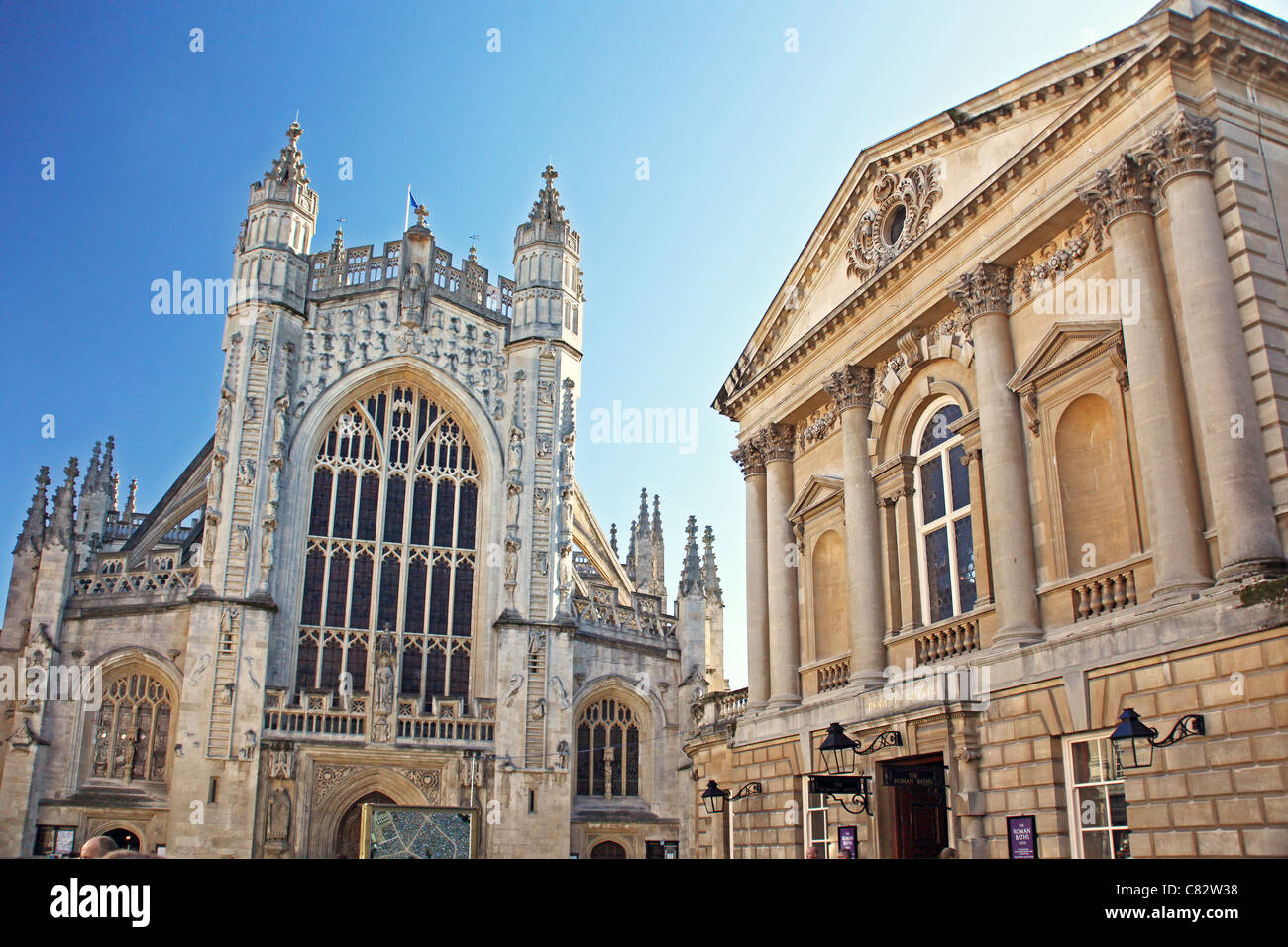 The entrance to The Roman Baths and west front of Bath Abbey in the ...