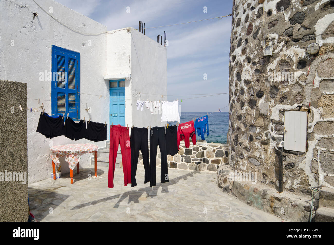 Washing on a line in front of a white washed house in Greece Stock ...