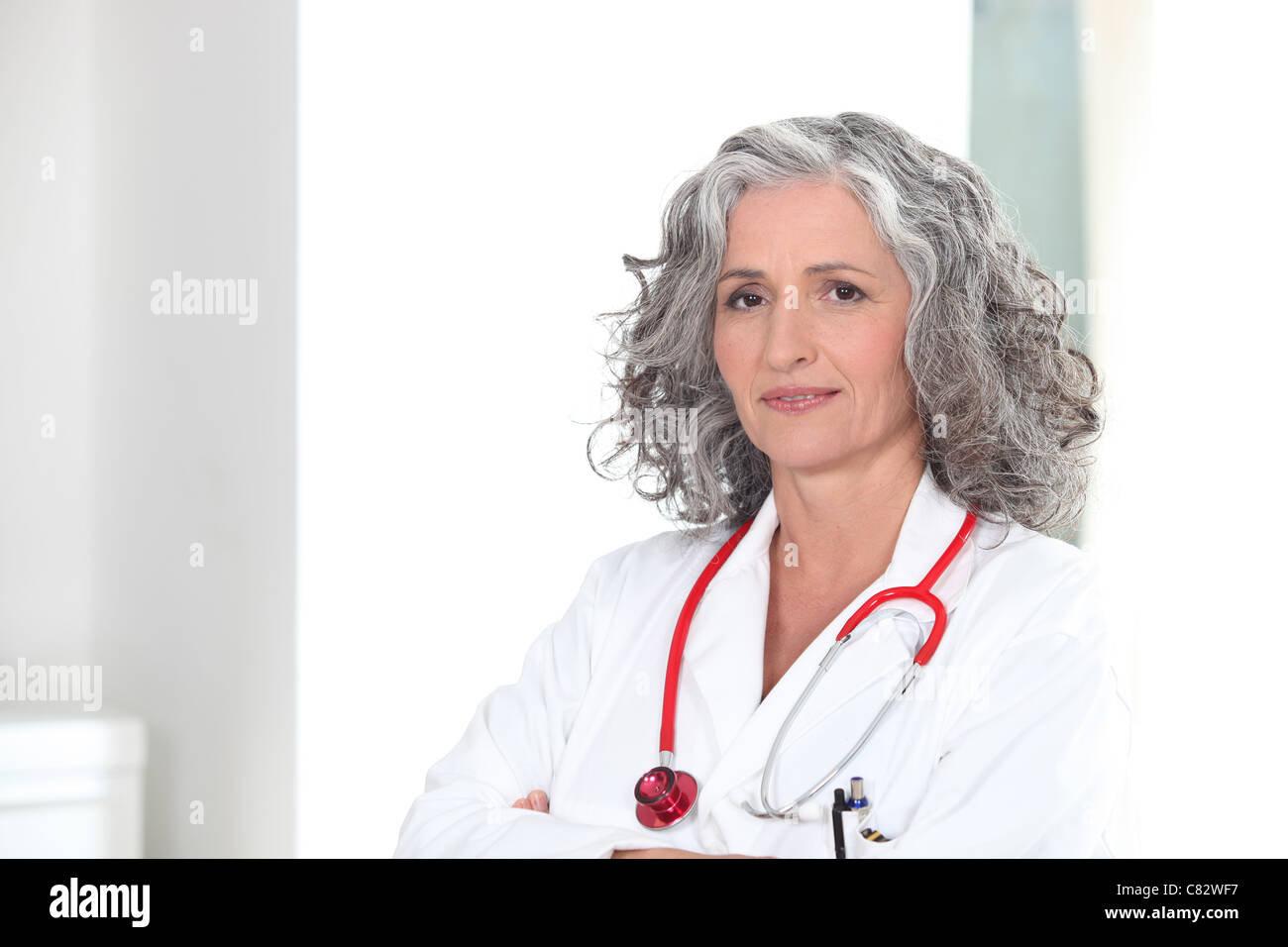 Positive attractive mature female doctor hi-res stock photography and ...