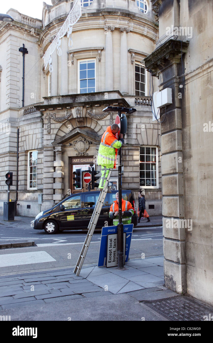 Highway engineers replacing traffic signs in Bridge Street, Bath, N.E ...