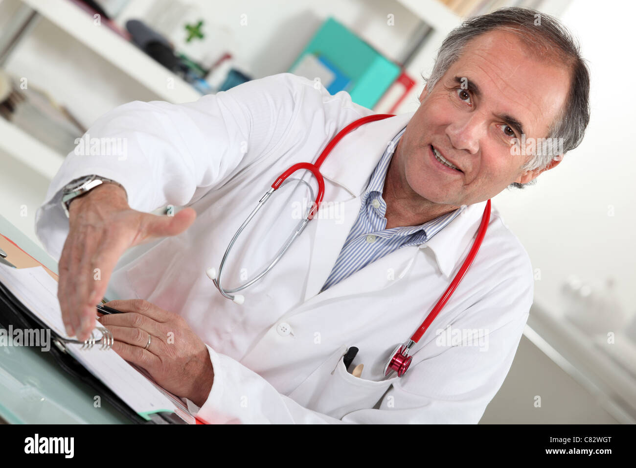 Doctor offering his hand Stock Photo - Alamy