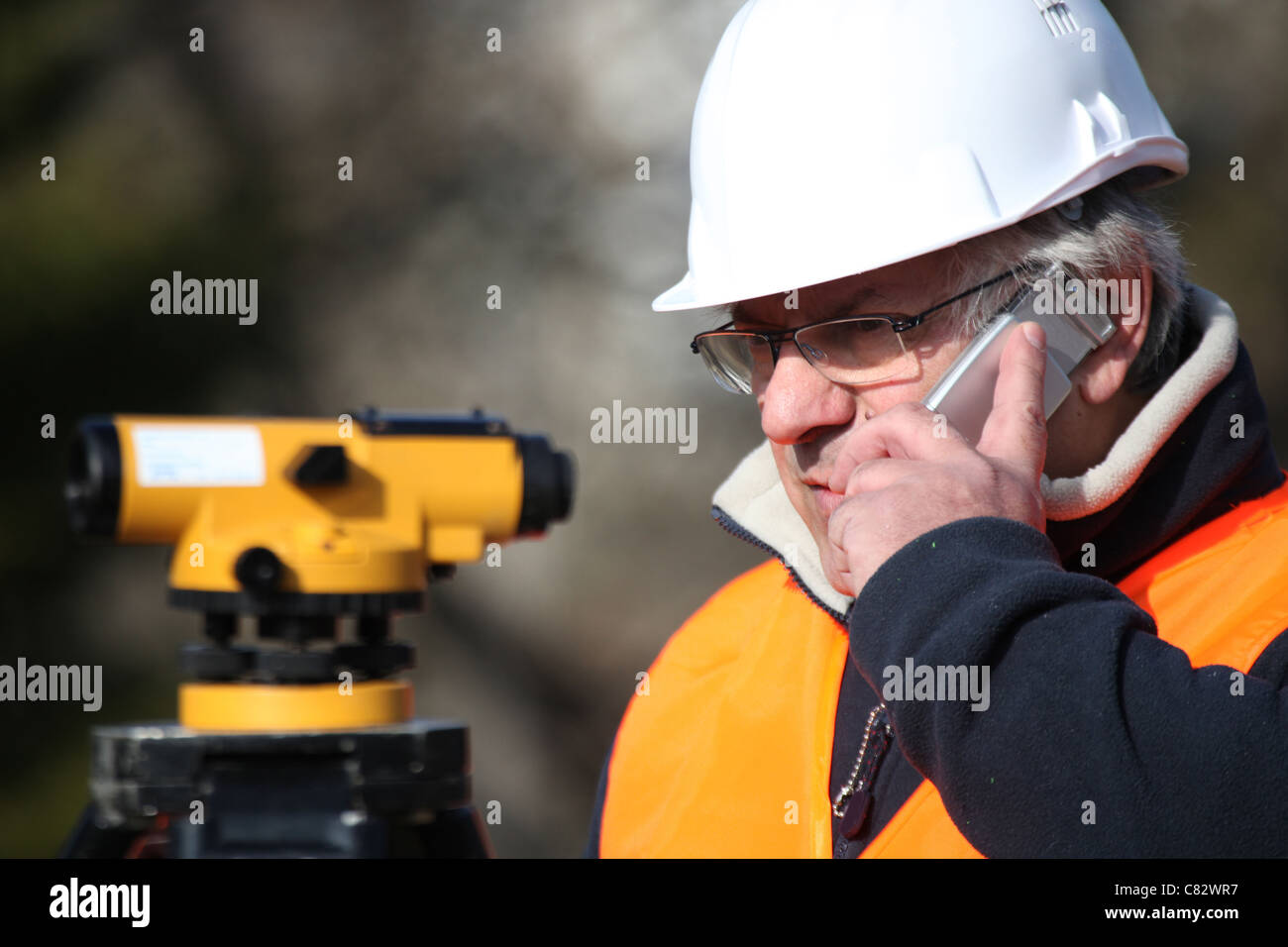 Civil engineer with surveying equipment Stock Photo - Alamy