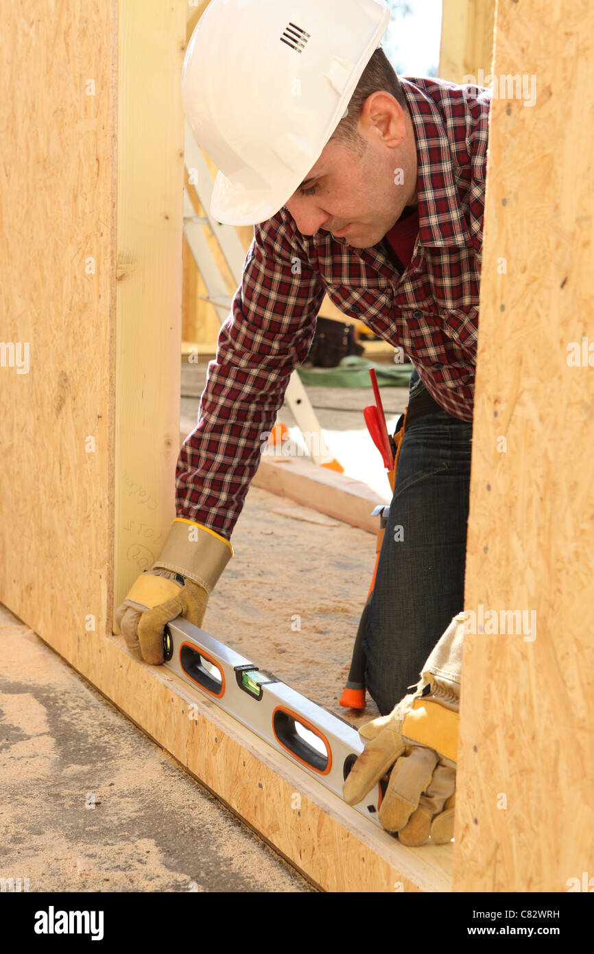 Woodworker using level spirit Stock Photo - Alamy