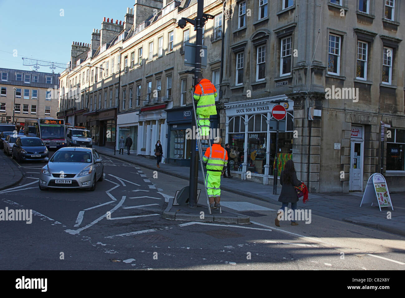 Highway engineers replacing traffic signs in Bridge Street, Bath, N.E ...