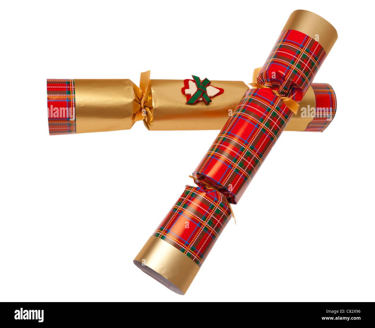Two chrismas crackers on a white isolated background Stock Photo - Alamy