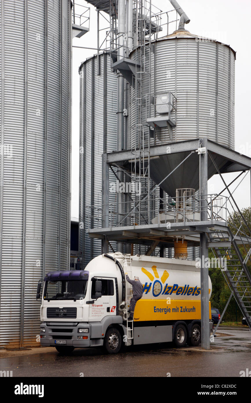 Wood pellets production. Pellets are filled from a silo in to a tanker ...