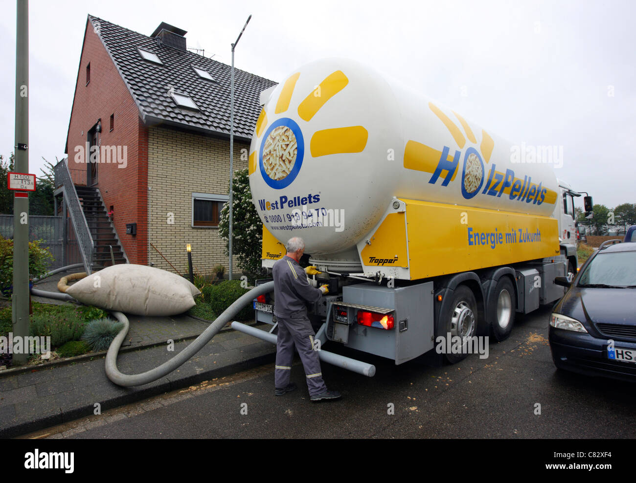 Delivery of wood pellets from a tanker truck to a private home. The ...