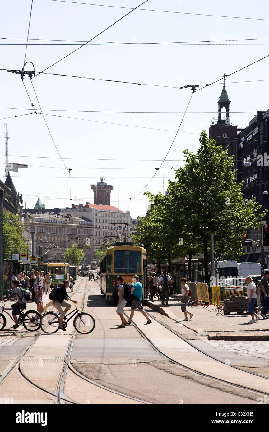 Busy street scene with a tram and pedestrians, Helsinki, Finland Stock ...