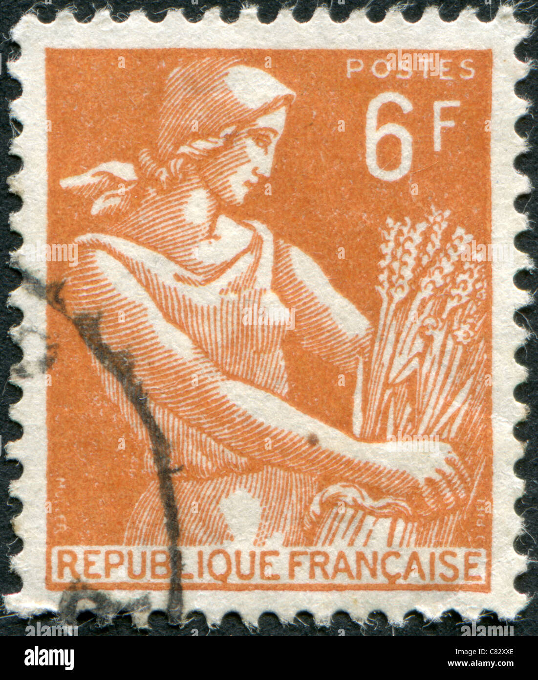 FRANCE - 1957: A stamp printed in France, shows a Farm Woman Stock ...