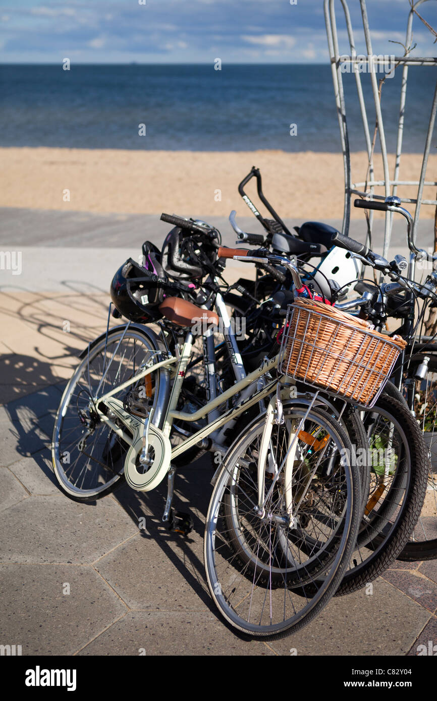 Bikes tied together along the beach in St. Kilda, Australia Stock Photo ...