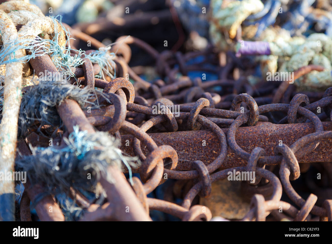 discarded rusty chains and worn fishing nets Stock Photo - Alamy