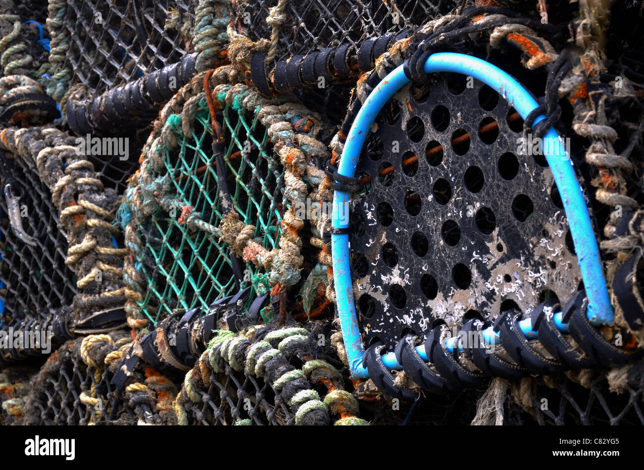 Lobster Pots stacked up at harbourside Stock Photo - Alamy