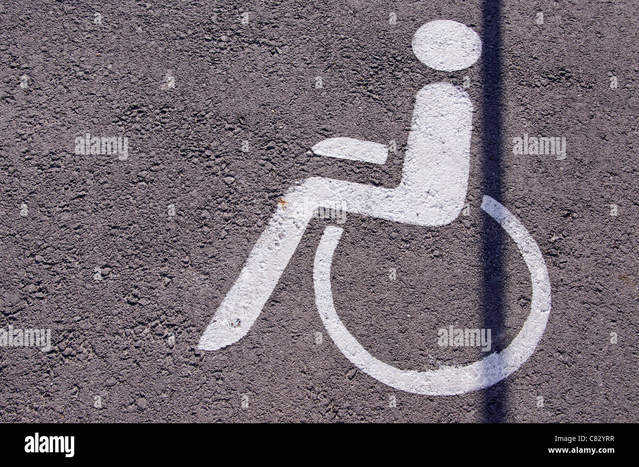 Invalid parking sign on asphalt in car parking place near supermarket ...