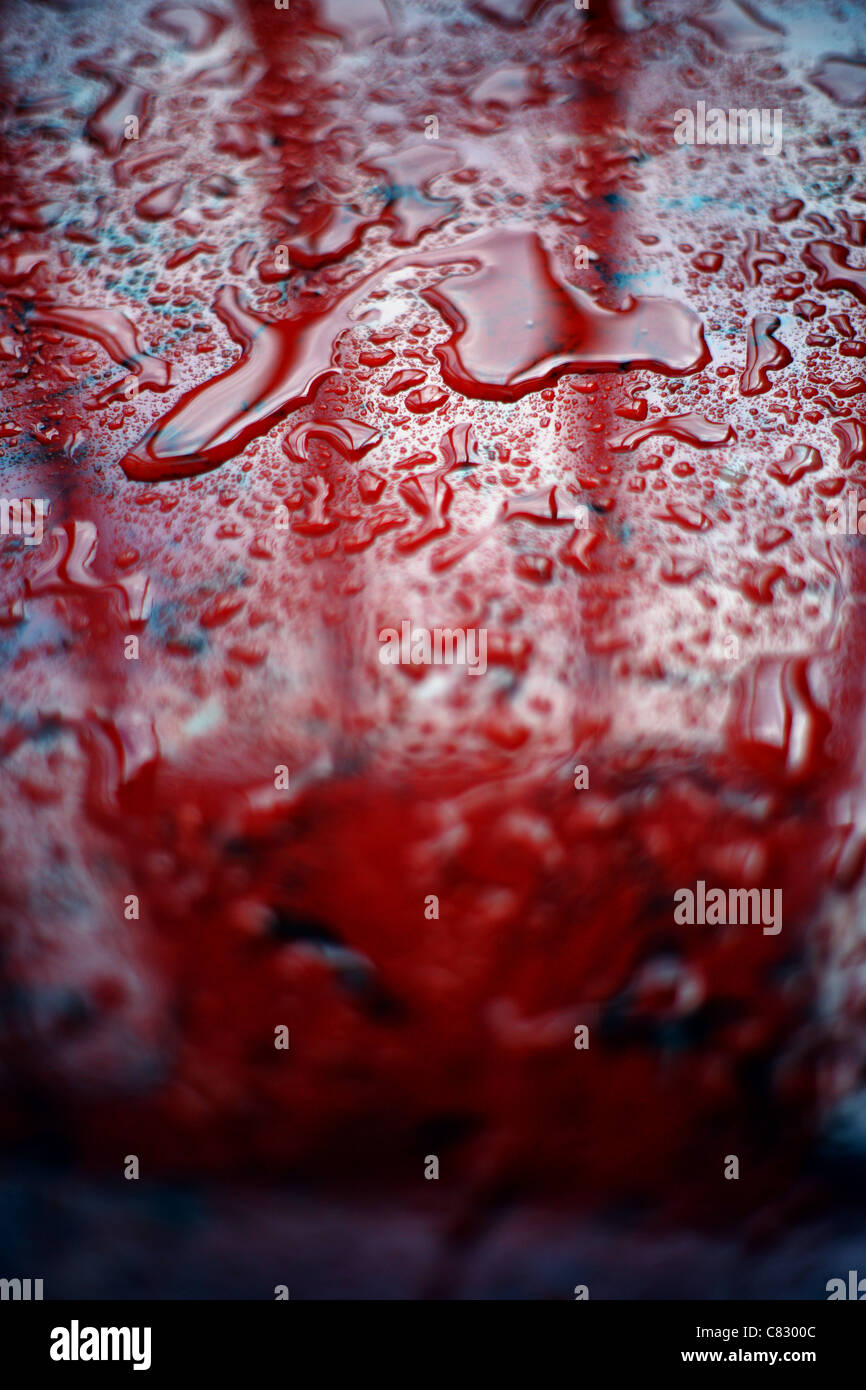 Water drops on red surface Stock Photo - Alamy