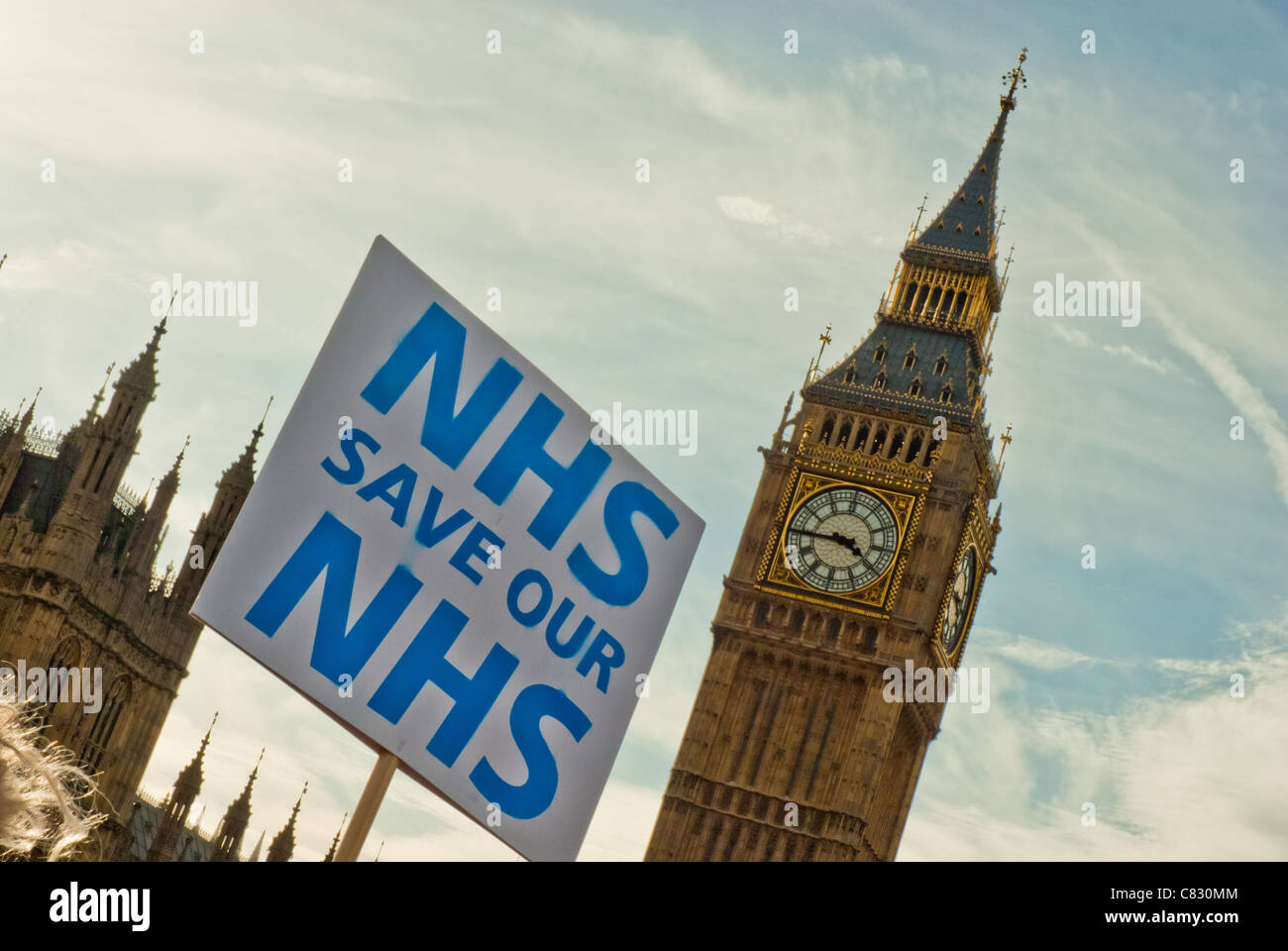 Single placard "NHS SAVE OUR NHS" against Big Ben both at a jaunty ...