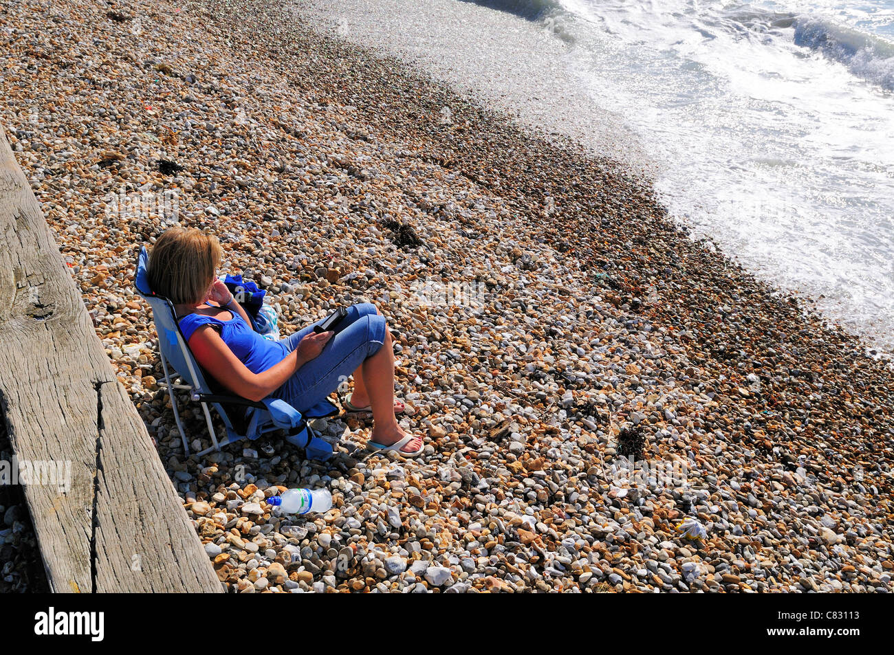 Woman relaxing on West Wittering's beach on ‘the hottest day of the ...