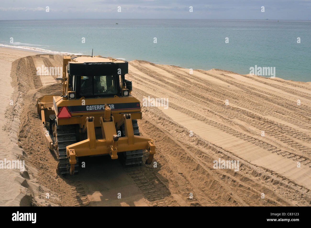Preparing the beach for the summer season Stock Photo - Alamy