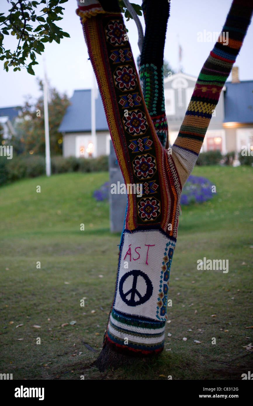 Hand knit sweaters for trees Stock Photo - Alamy