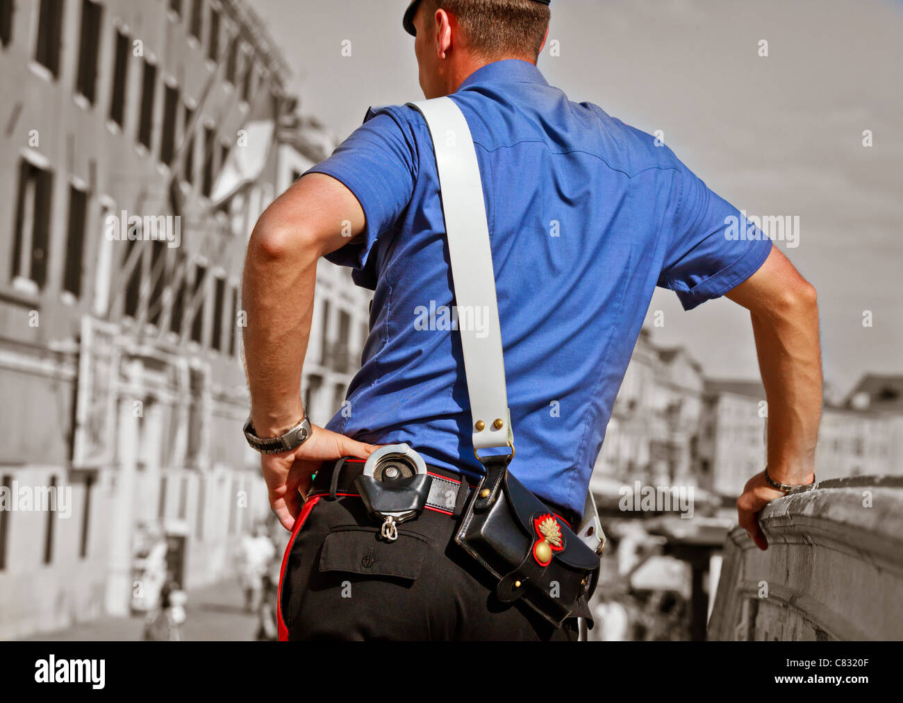 Backside of police officer from Venice standing on a bridge, Venice ...