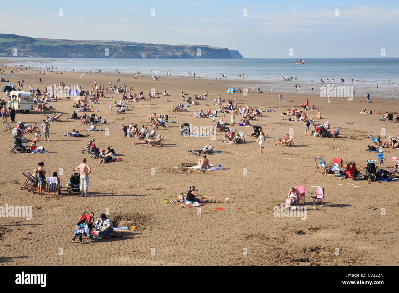 People enjoying the October sunshine on the beach at Whitby Stock Photo ...