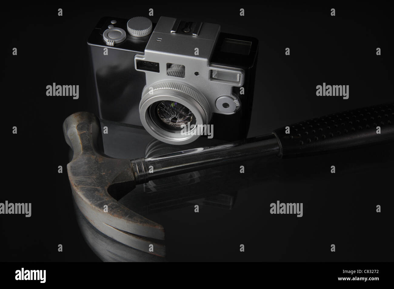 camera lens smashed by hammer. Low key Stock Photo - Alamy