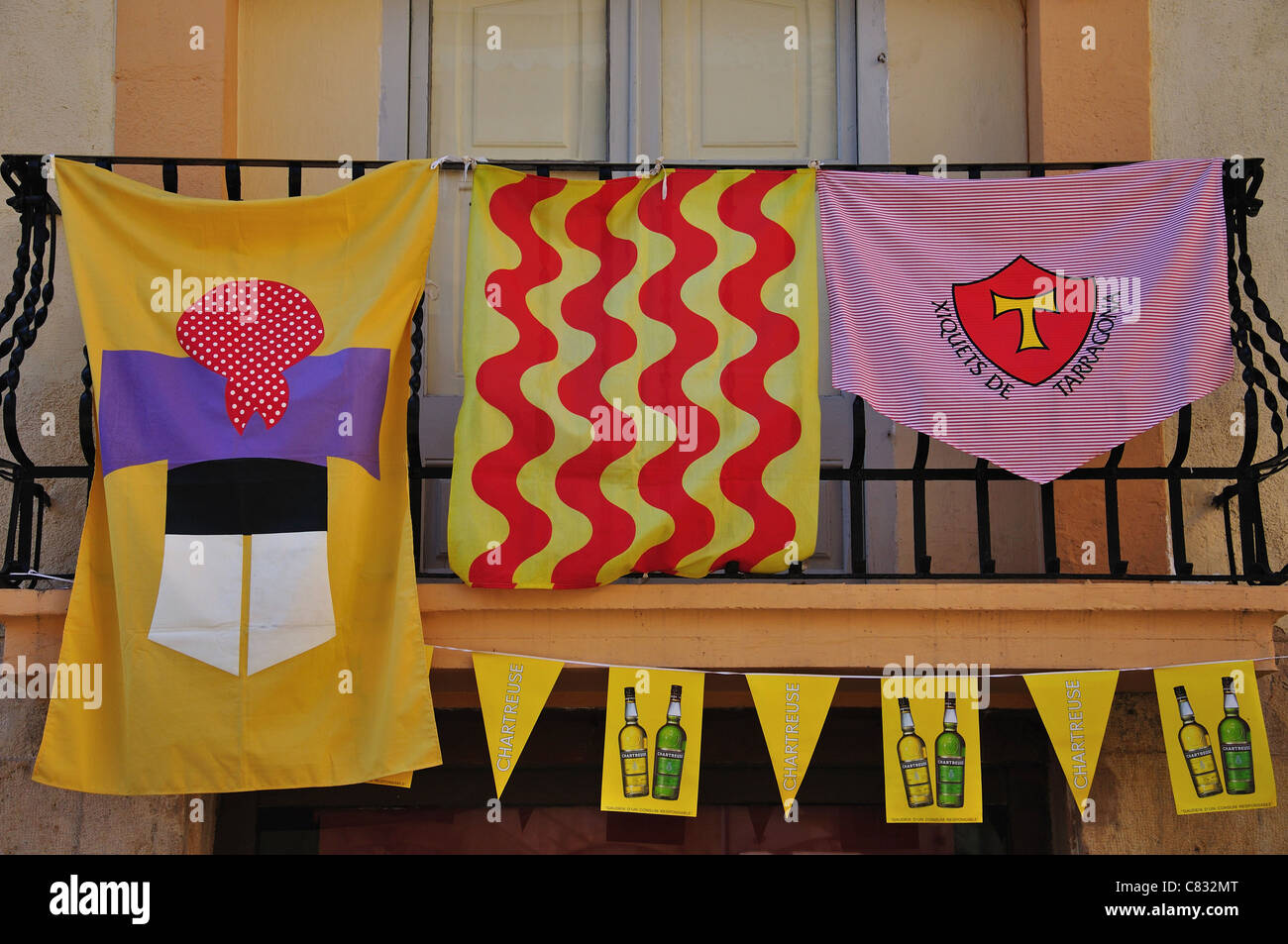 Local flags hanging on balcony, Placa de La Font, Old Town, Tarragona ...