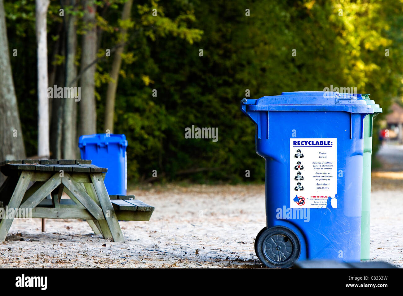 Blue recycle bin on a beach Stock Photo - Alamy