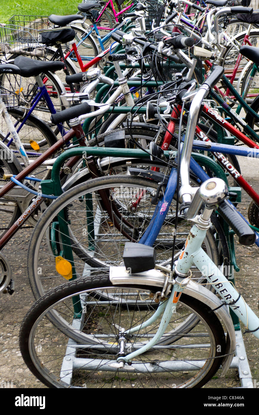 bicycles chained to stands Stock Photo - Alamy