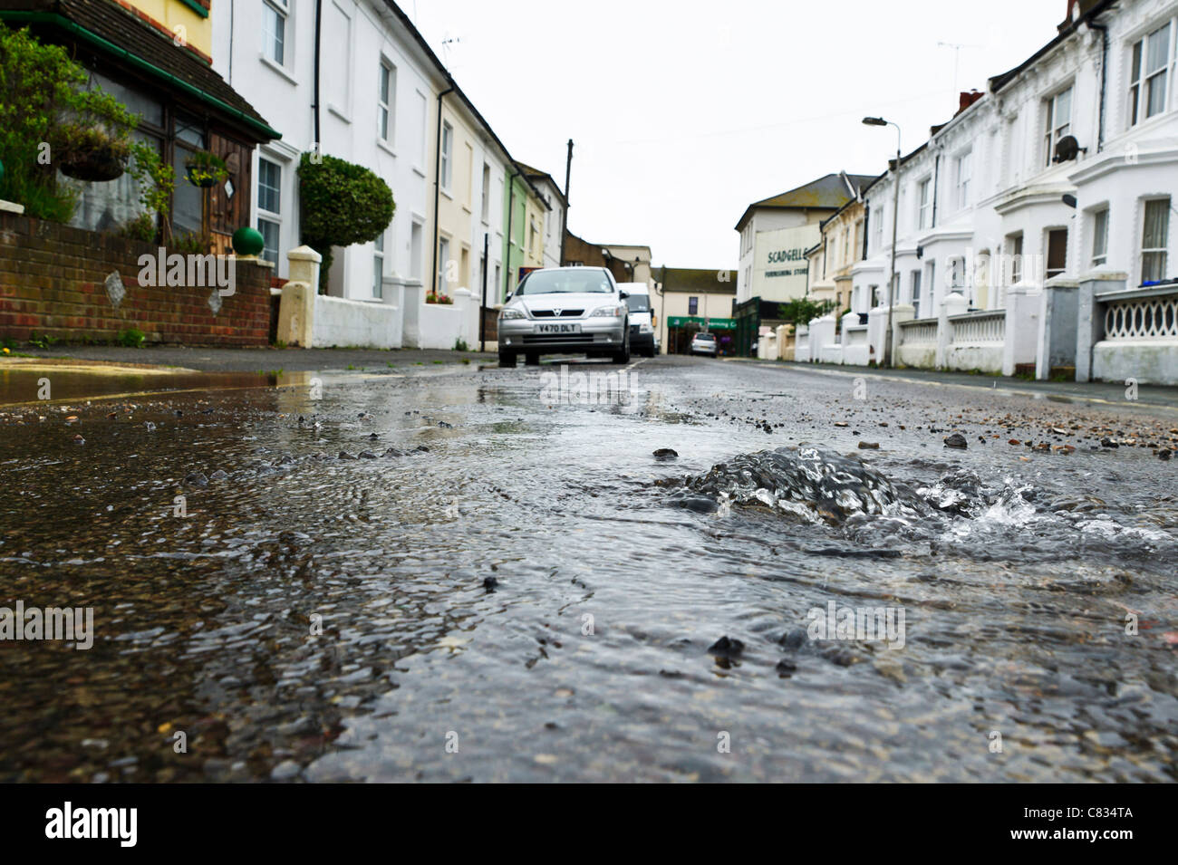 Water leak in the middle of a residential road caused by a burst water ...